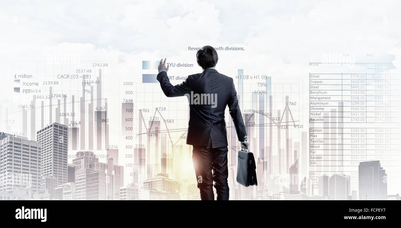 Rear view of businessman looking at business marketing strategy Stock ...