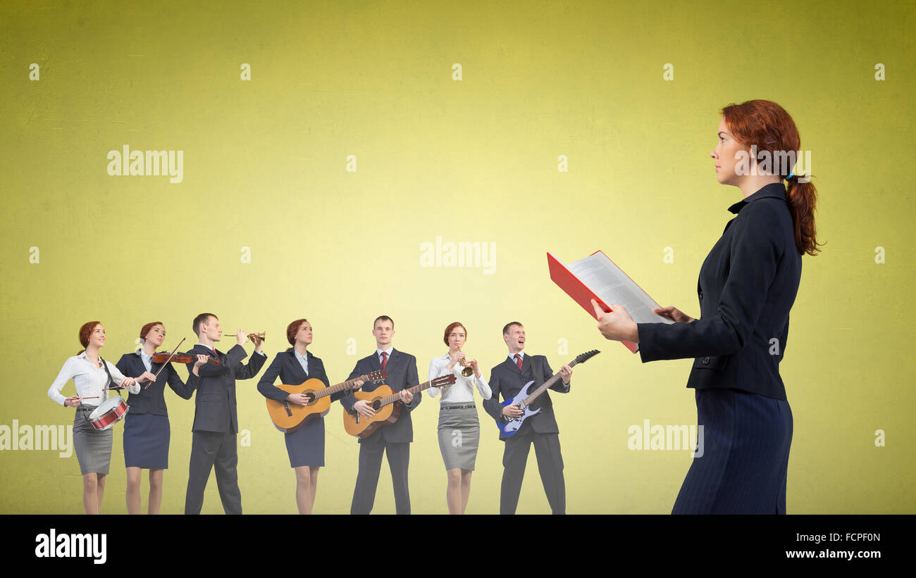 Young woman with book and playing different music instruments Stock ...