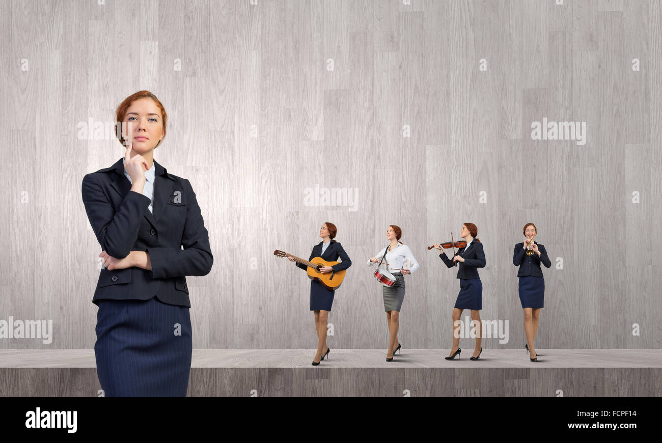 Young woman in suit playing different music instruments Stock Photo - Alamy