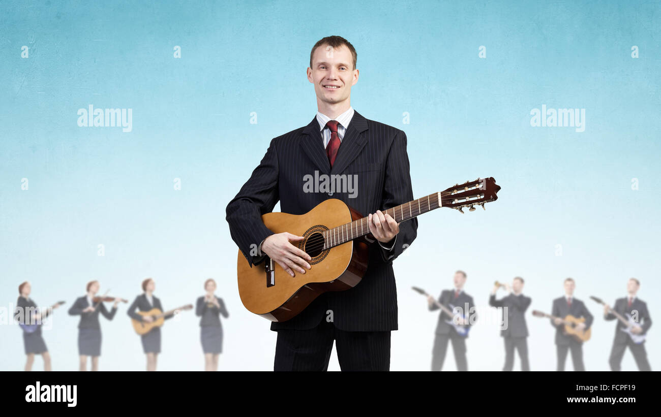 Young man in suit and people playing different music instruments Stock ...
