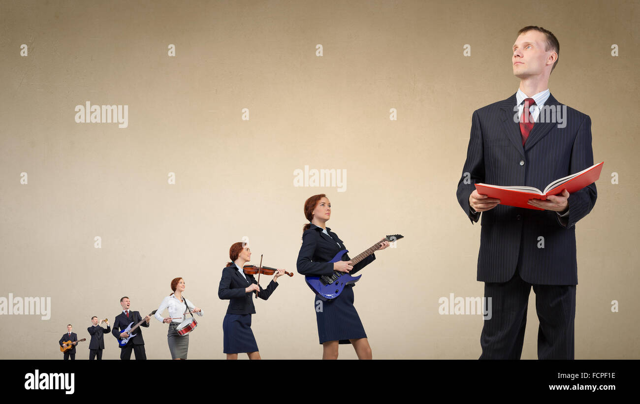 Young man in suit and people playing different music instruments Stock ...