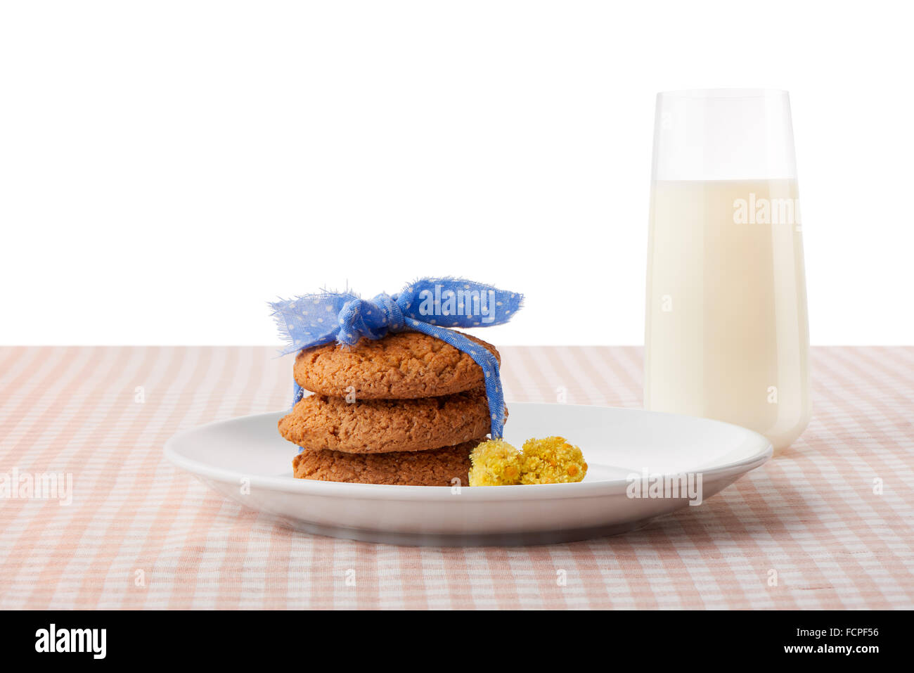 Stack of three homemade oatmeal cookies tied with blue ribbon and ...