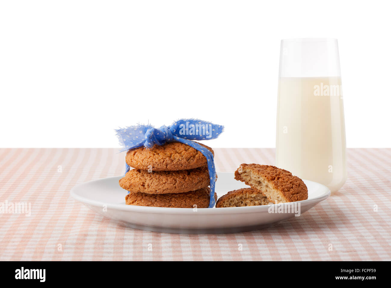 Stack of three homemade oatmeal cookies tied with blue ribbon and ...