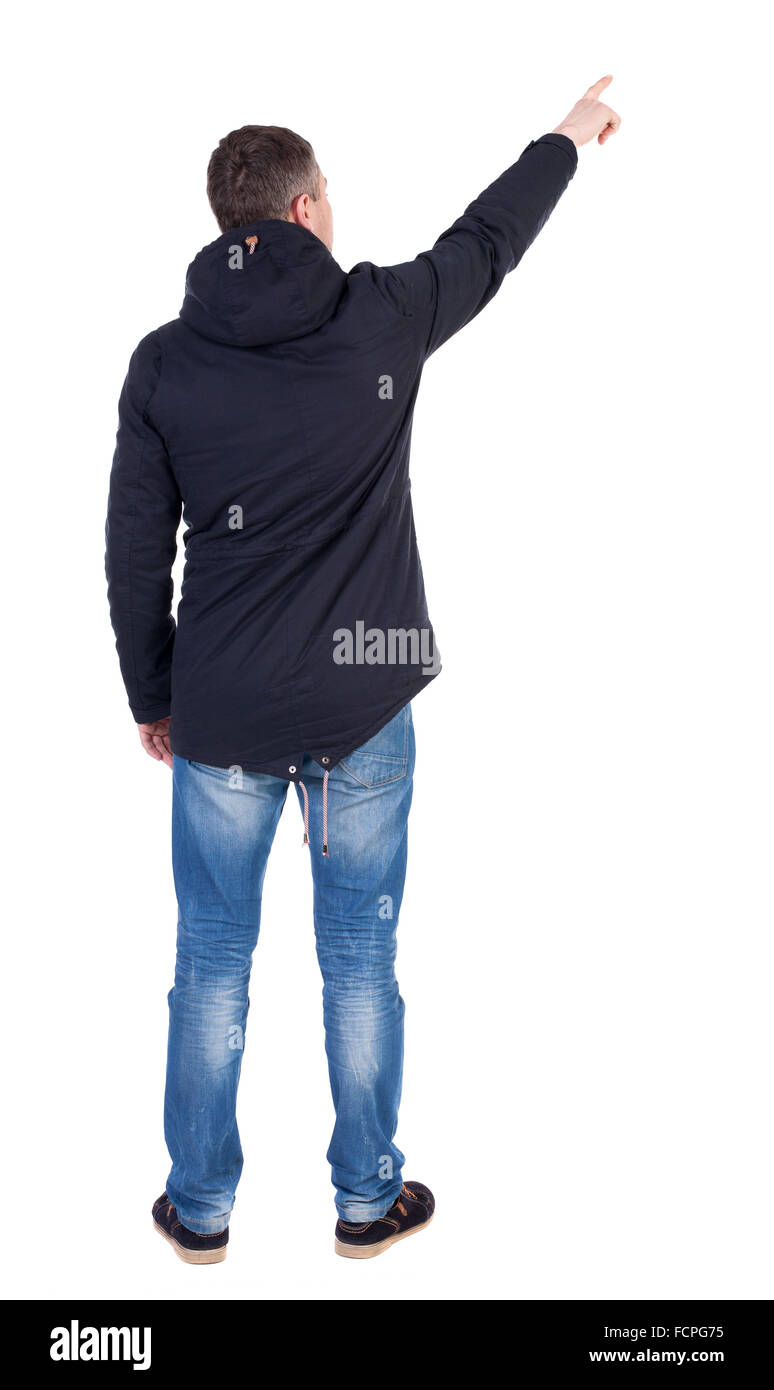 Back view of pointing young men in parka. Young guy gesture. Rear view ...