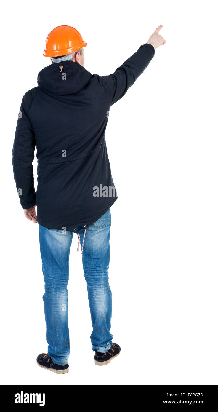 Back view of pointing young men in parka and helmet. Young guy gesture ...