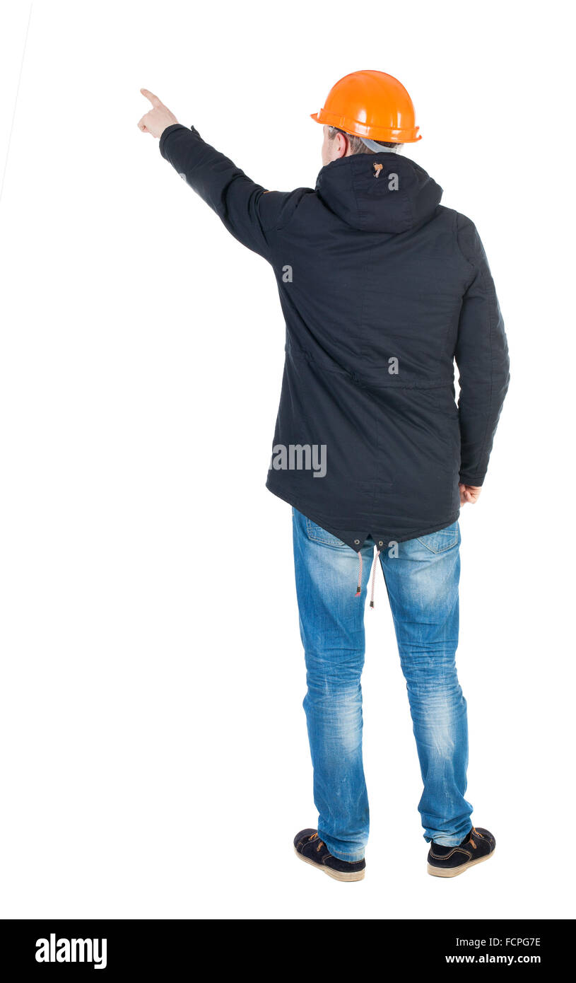 Back view of pointing young men in parka and helmet. Young guy gesture ...