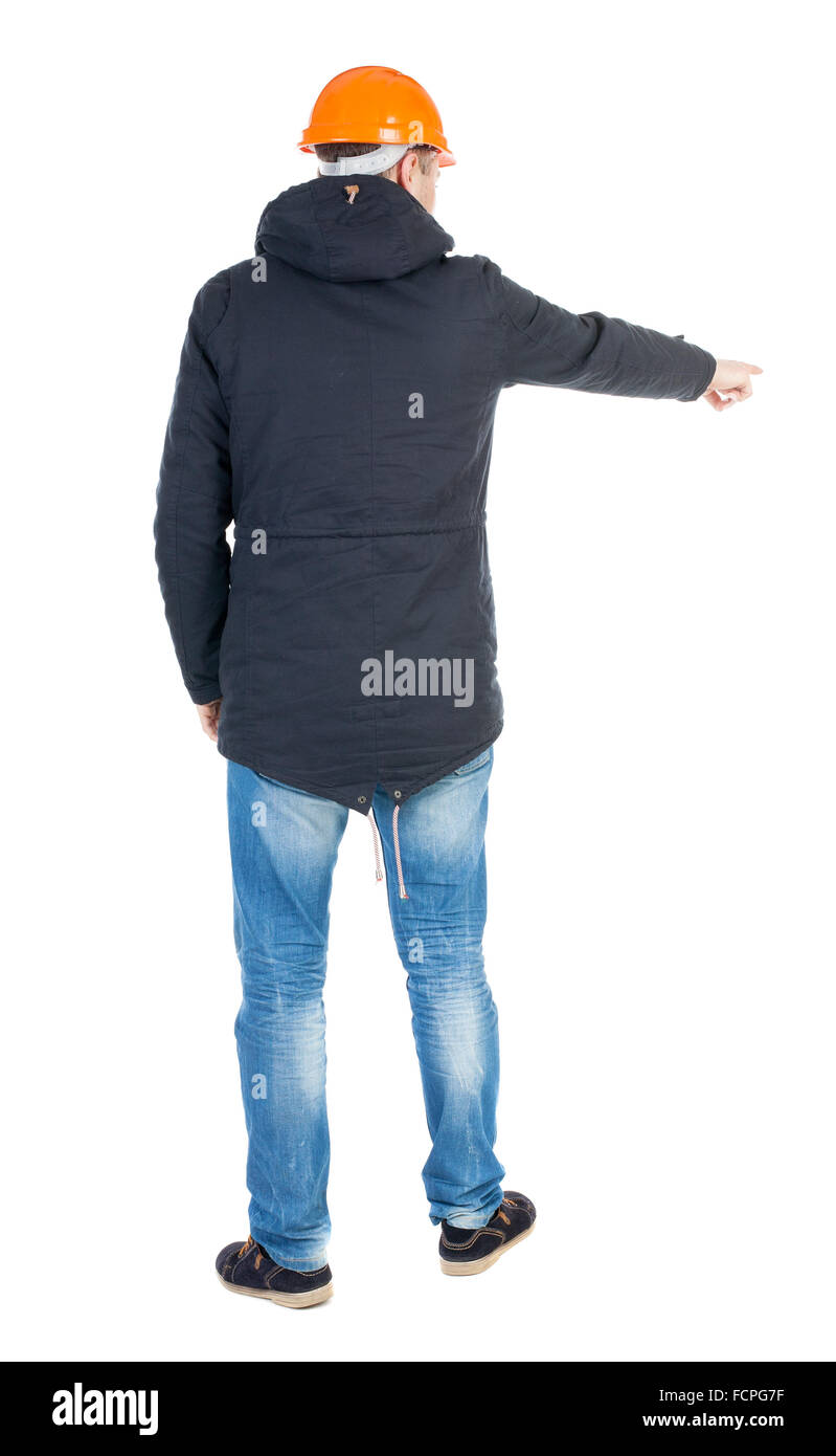 Back view of pointing young men in parka and helmet. Young guy gesture ...