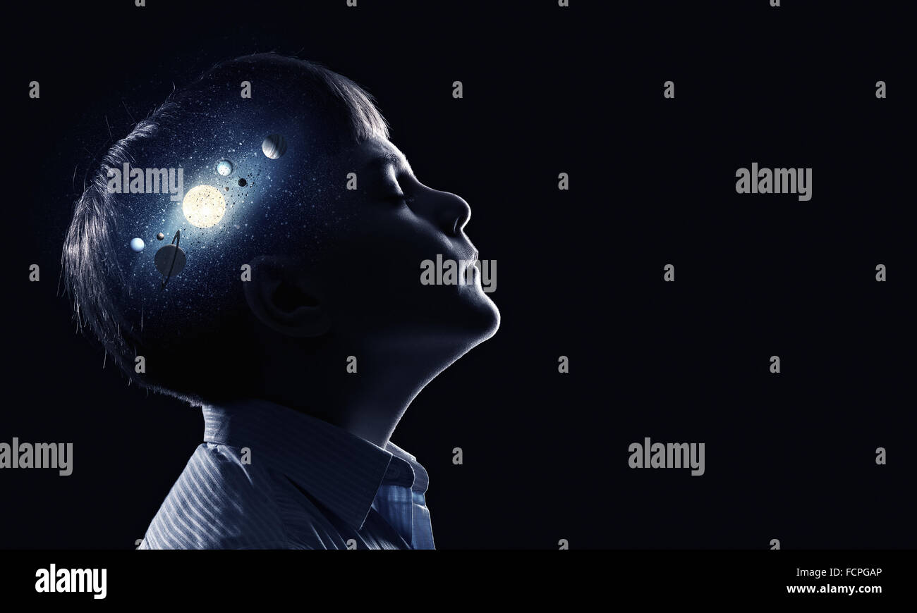 Cute boy of school age exploring space system Stock Photo - Alamy
