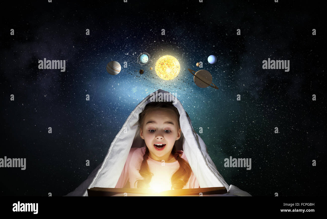 Cute girl of school age exploring space system Stock Photo - Alamy