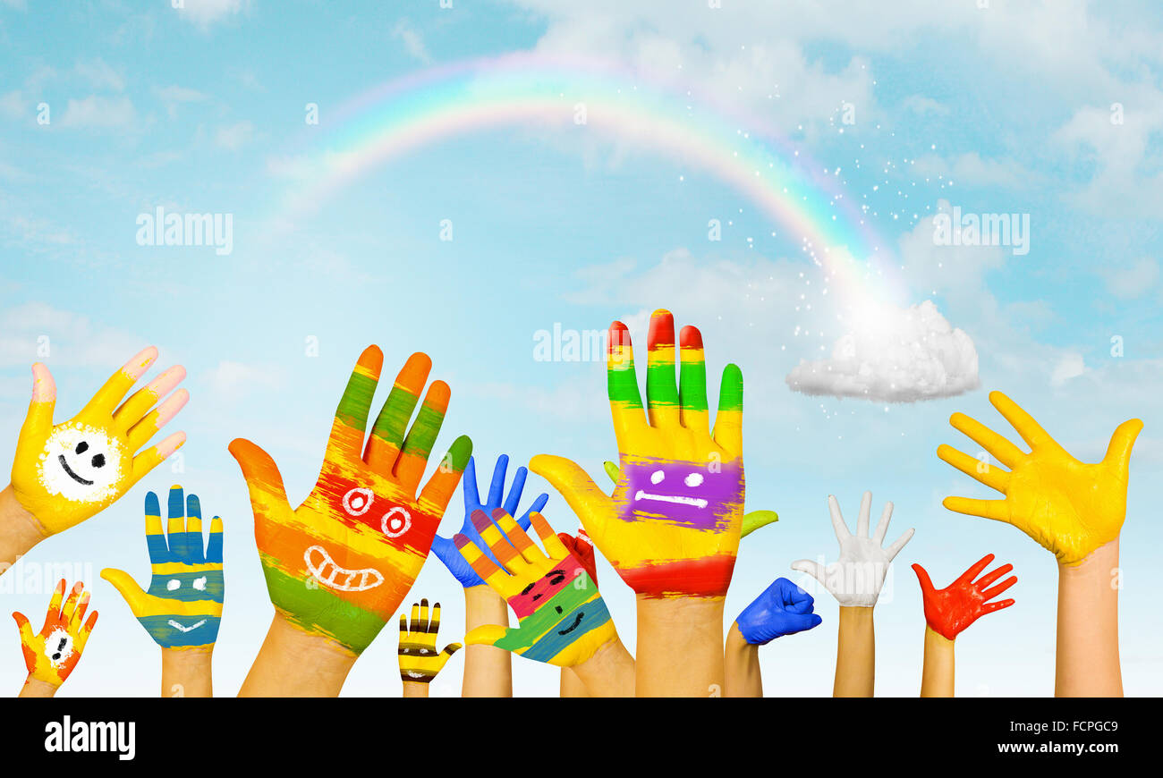 Image of human hands in colorful paint with smiles Stock Photo - Alamy