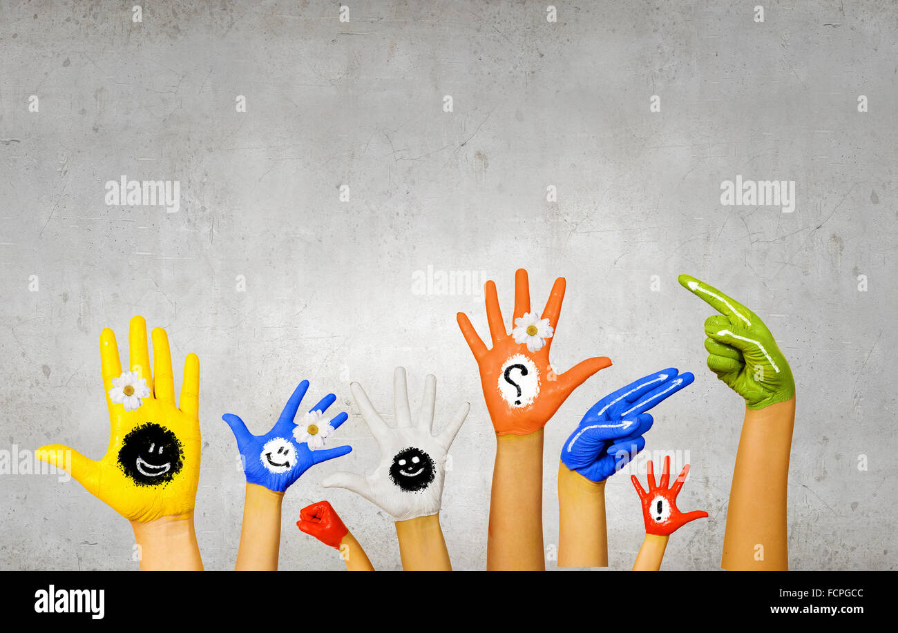 Image of human hands in colorful paint with smiles Stock Photo - Alamy