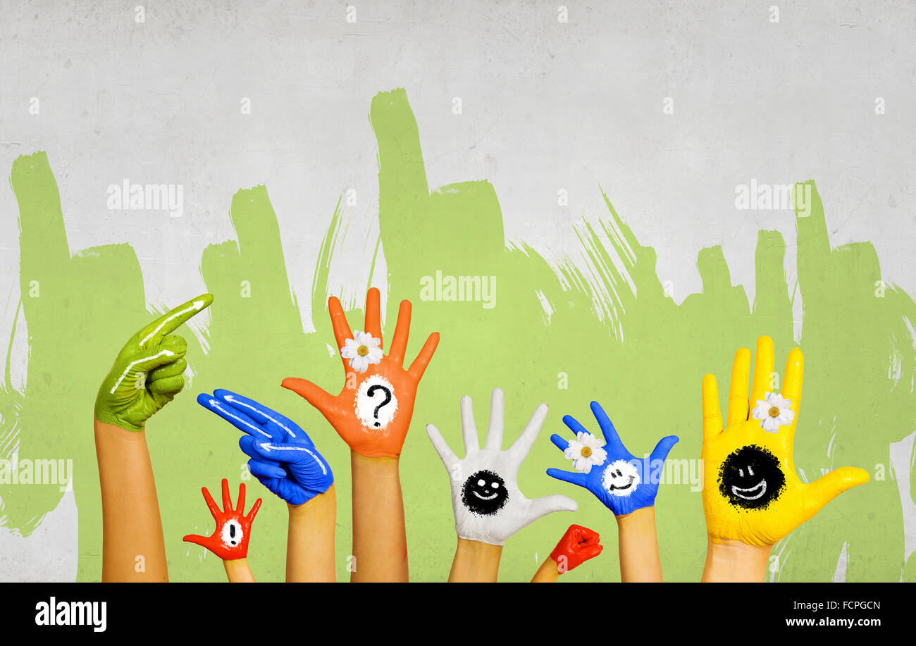 Image of human hands in colorful paint with smiles Stock Photo - Alamy
