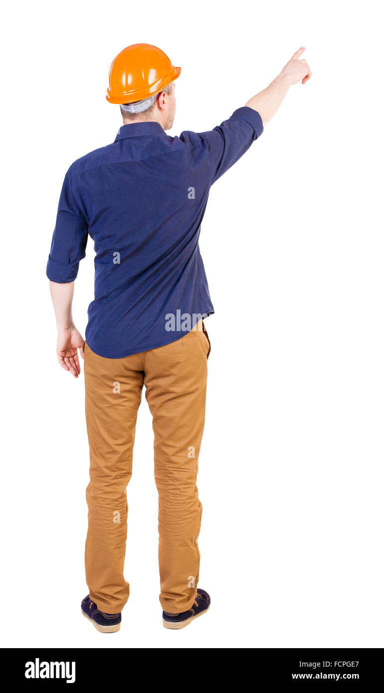 Back view of pointing young men in shirt and helmet. Young guy gesture ...