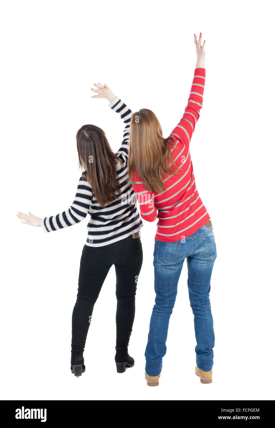 Back view of two young brunette standing woman l . beautiful girl ...