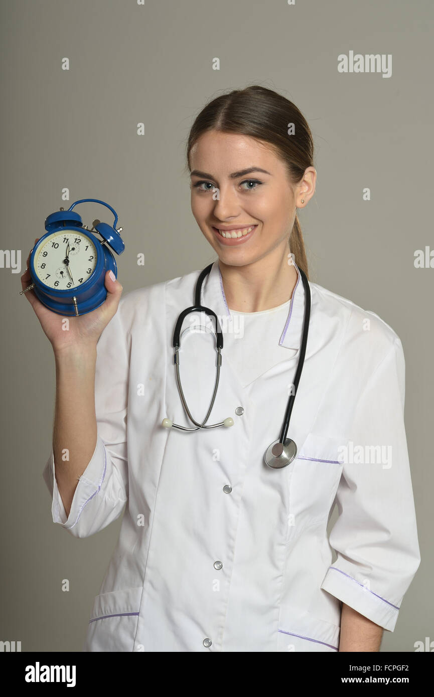 doctor with clock Stock Photo - Alamy