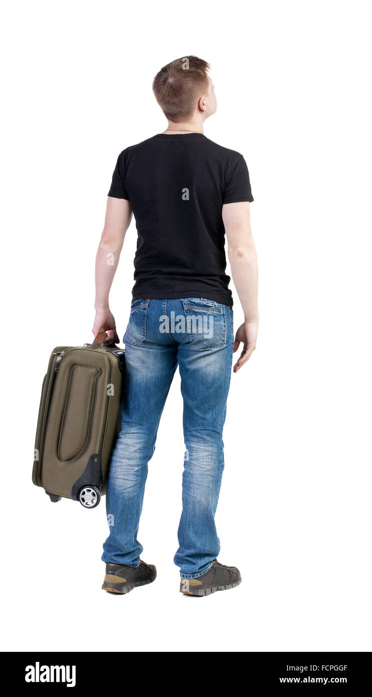 Back view of man with green suitcase looking up. Rear view people ...