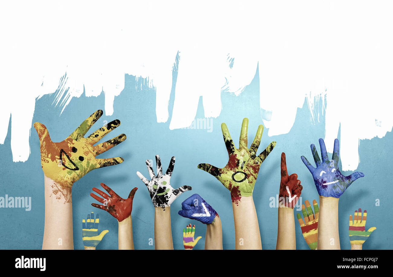 Image of human hands in colorful paint with smiles Stock Photo - Alamy