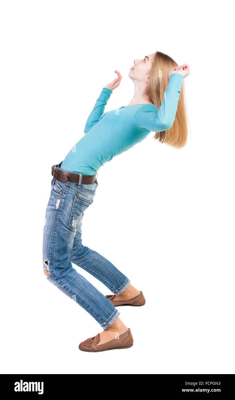 Balancing young woman. or dodge falling woman. Rear view people ...