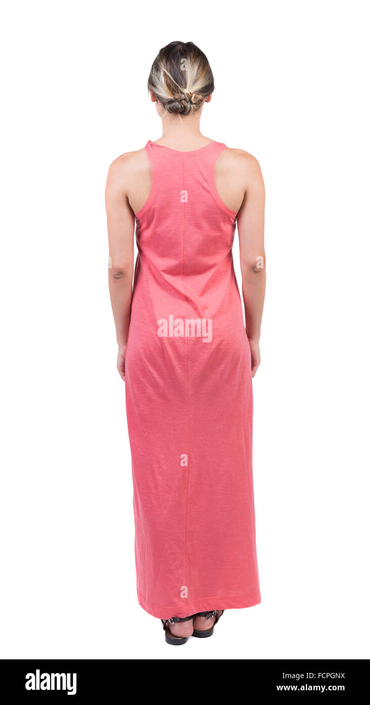 back view of standing young beautiful woman. girl watching. Rear view ...