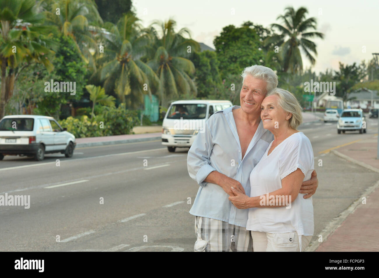 elderly couple rest at tropical resort Stock Photo - Alamy