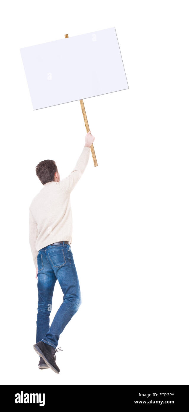 Back view man showing sign board. man holds information plate. Rear ...