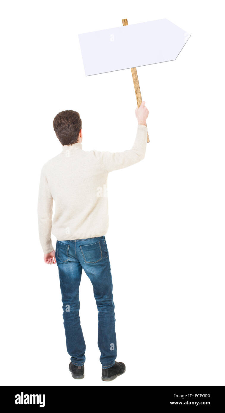 Back view man showing sign board. man holds information plate. Rear ...