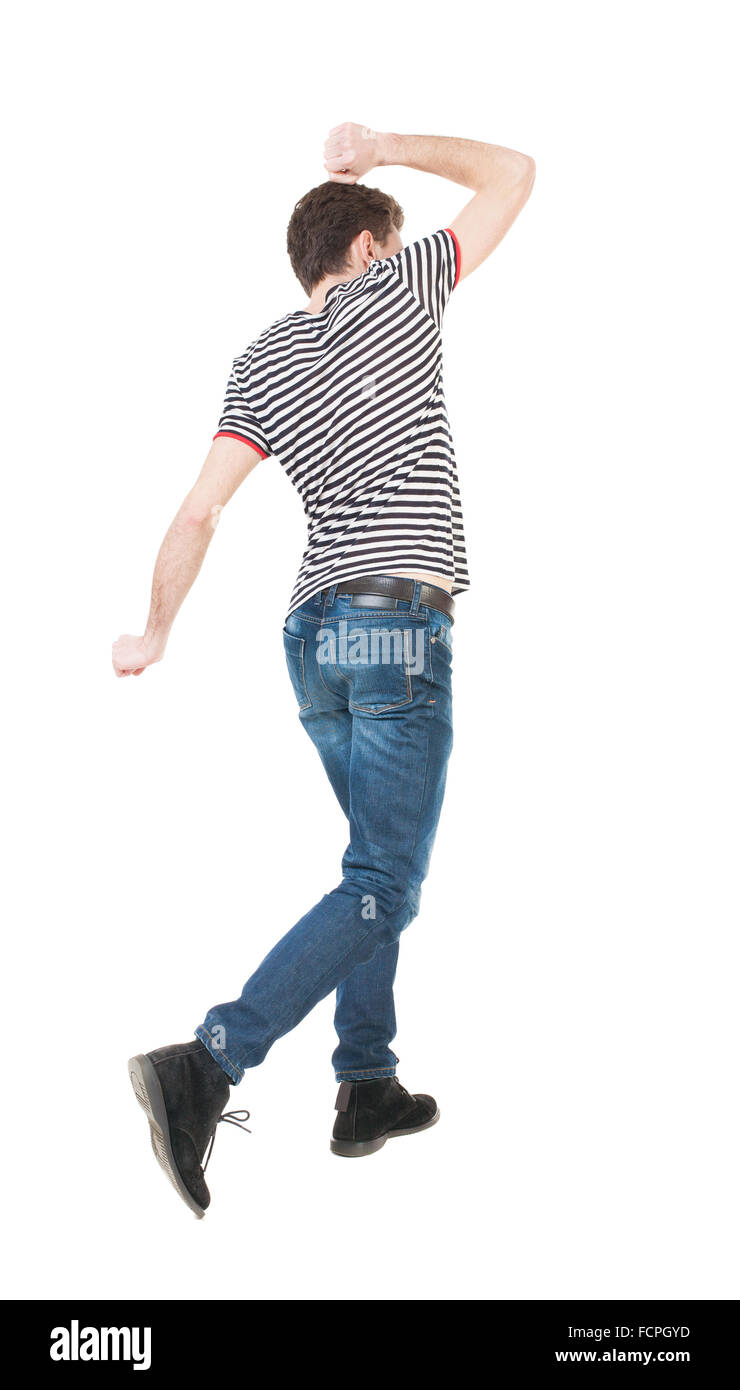 Back view of running man in brown shirt. Walking guy in motion. Rear ...