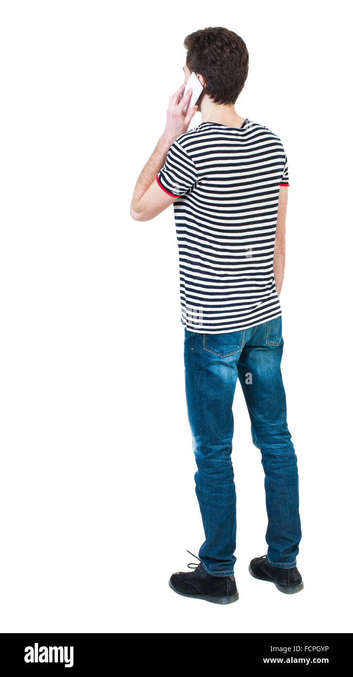 Back view of pointing young men talking on cell phone. Young guy ...