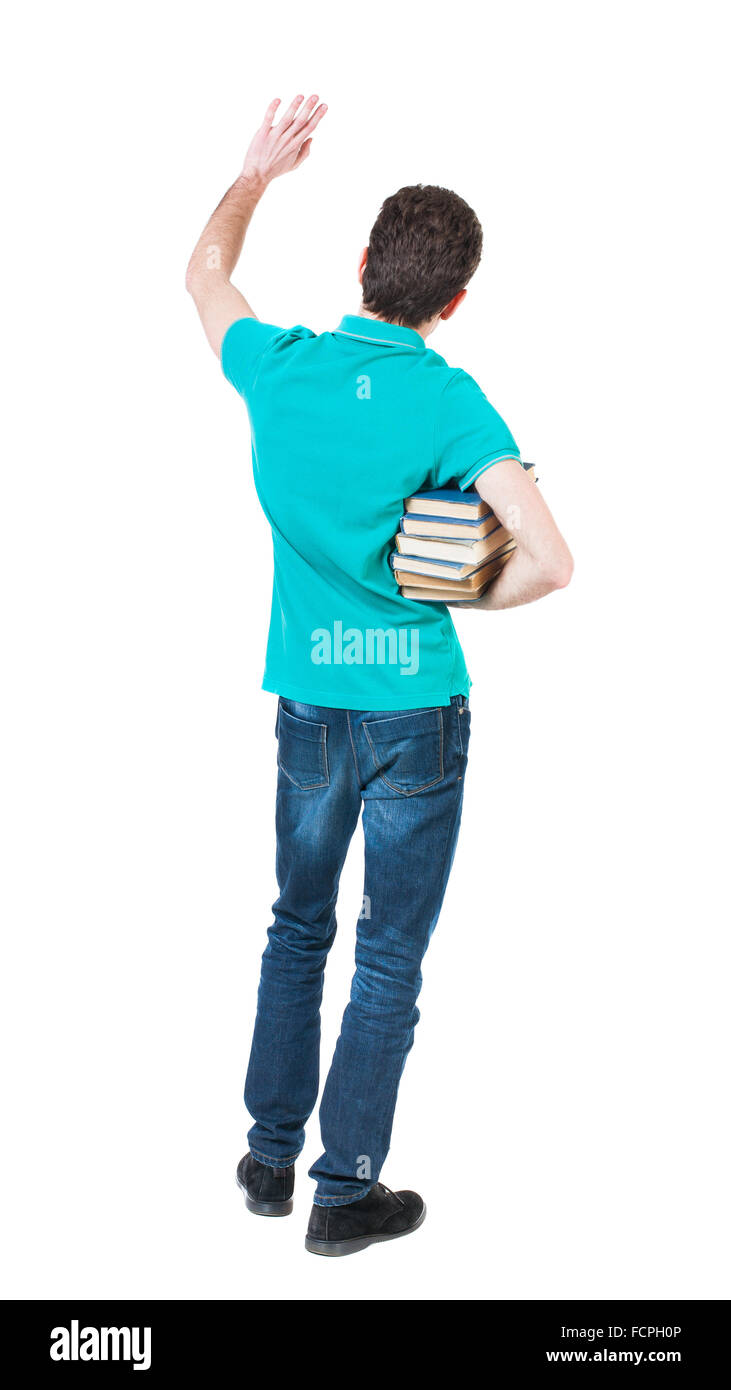 A man carries a heavy pile of books and waves . back view. Rear view ...