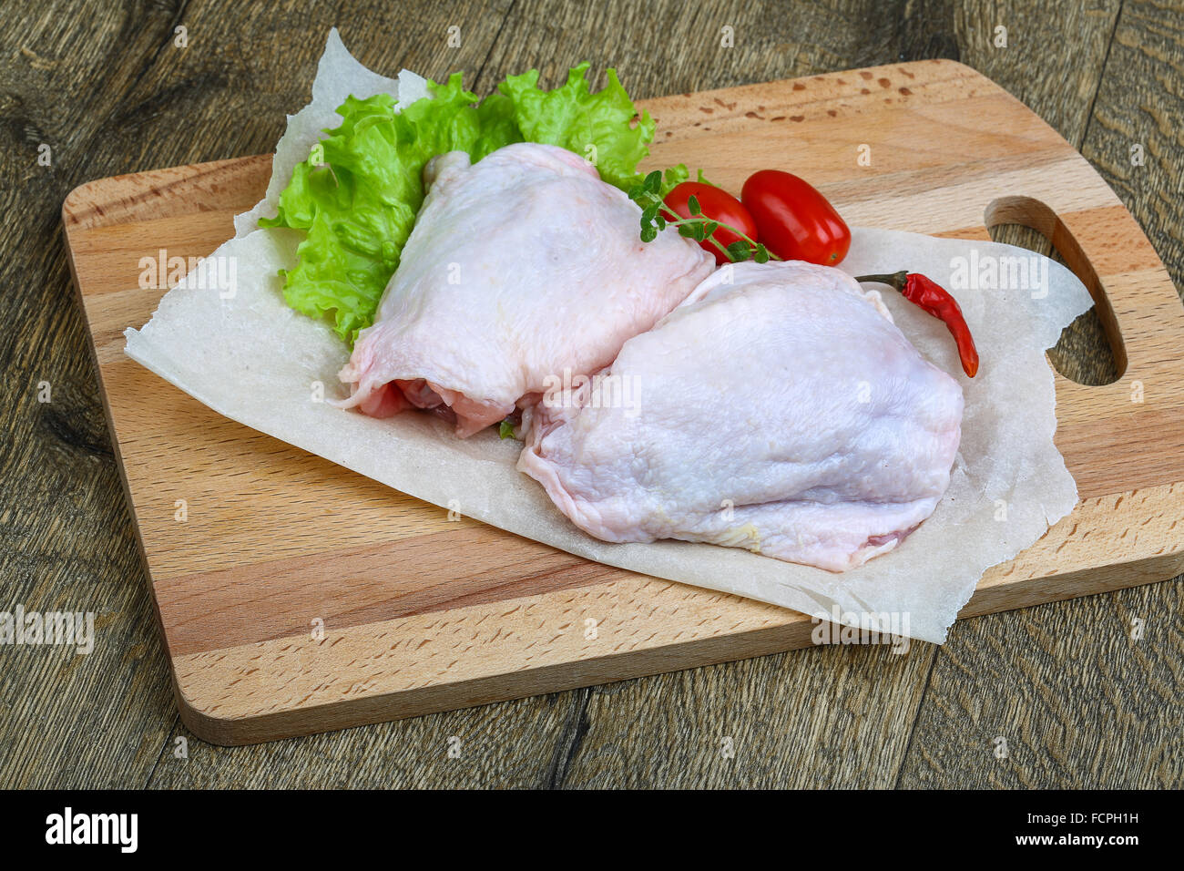Raw chicken legs meat with herbs and spices ready for cooking Stock ...