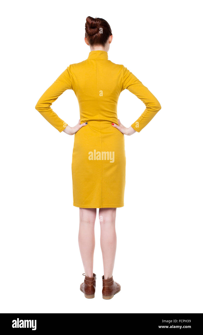 back view of standing young beautiful woman. girl watching. Rear view ...