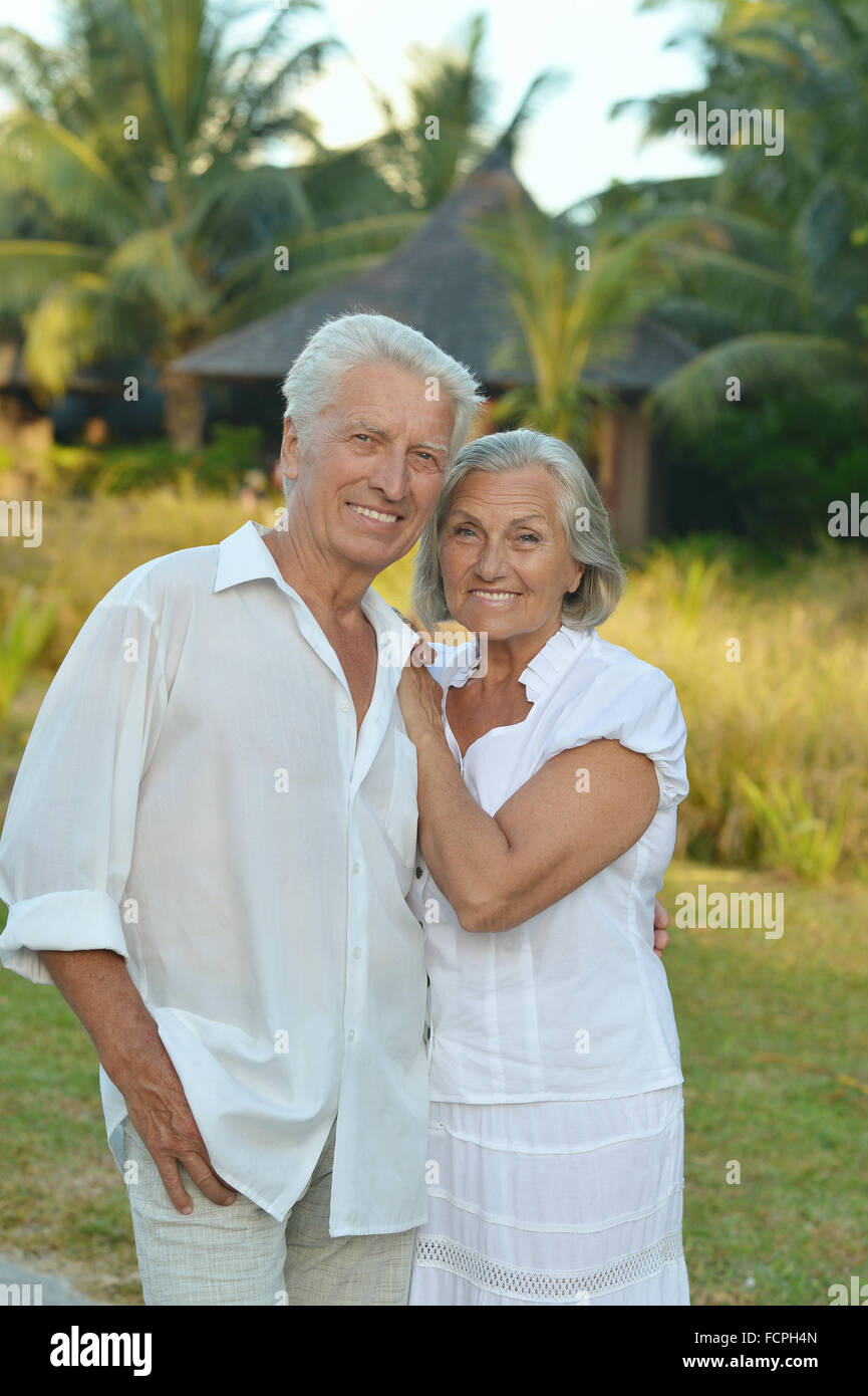 elderly couple rest at tropical resort Stock Photo - Alamy