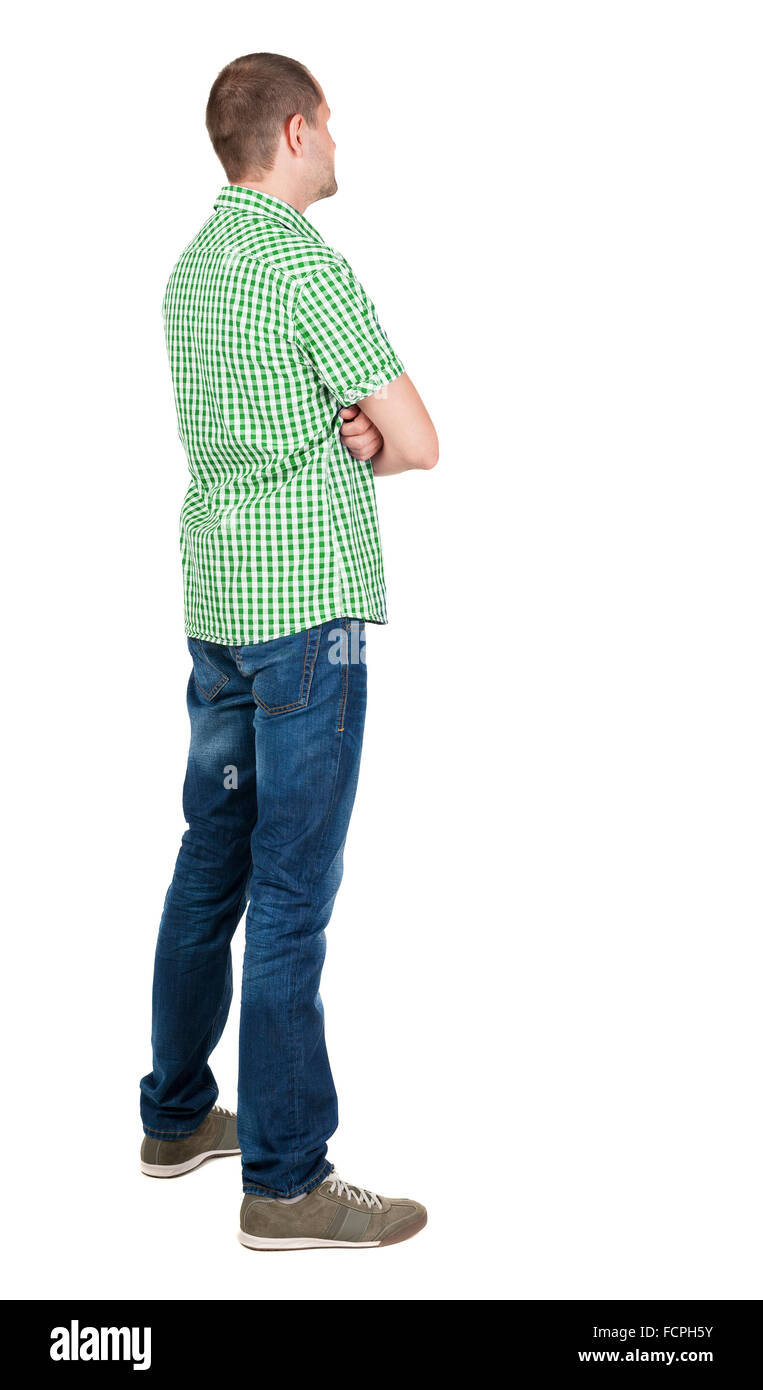 Back view of handsome man in shirt looking up. Standing young guy in ...