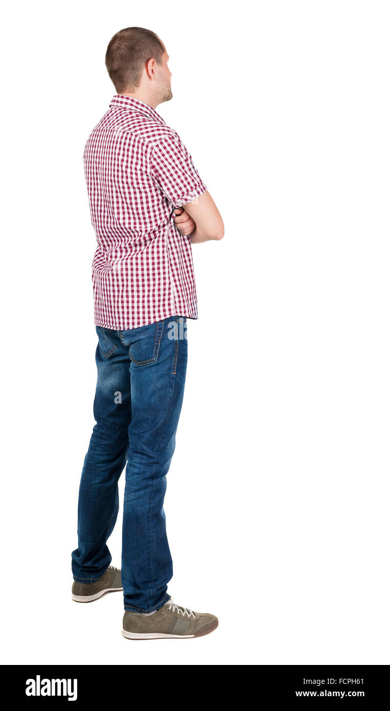 Back view of handsome man in shirt looking up. Standing young guy in ...