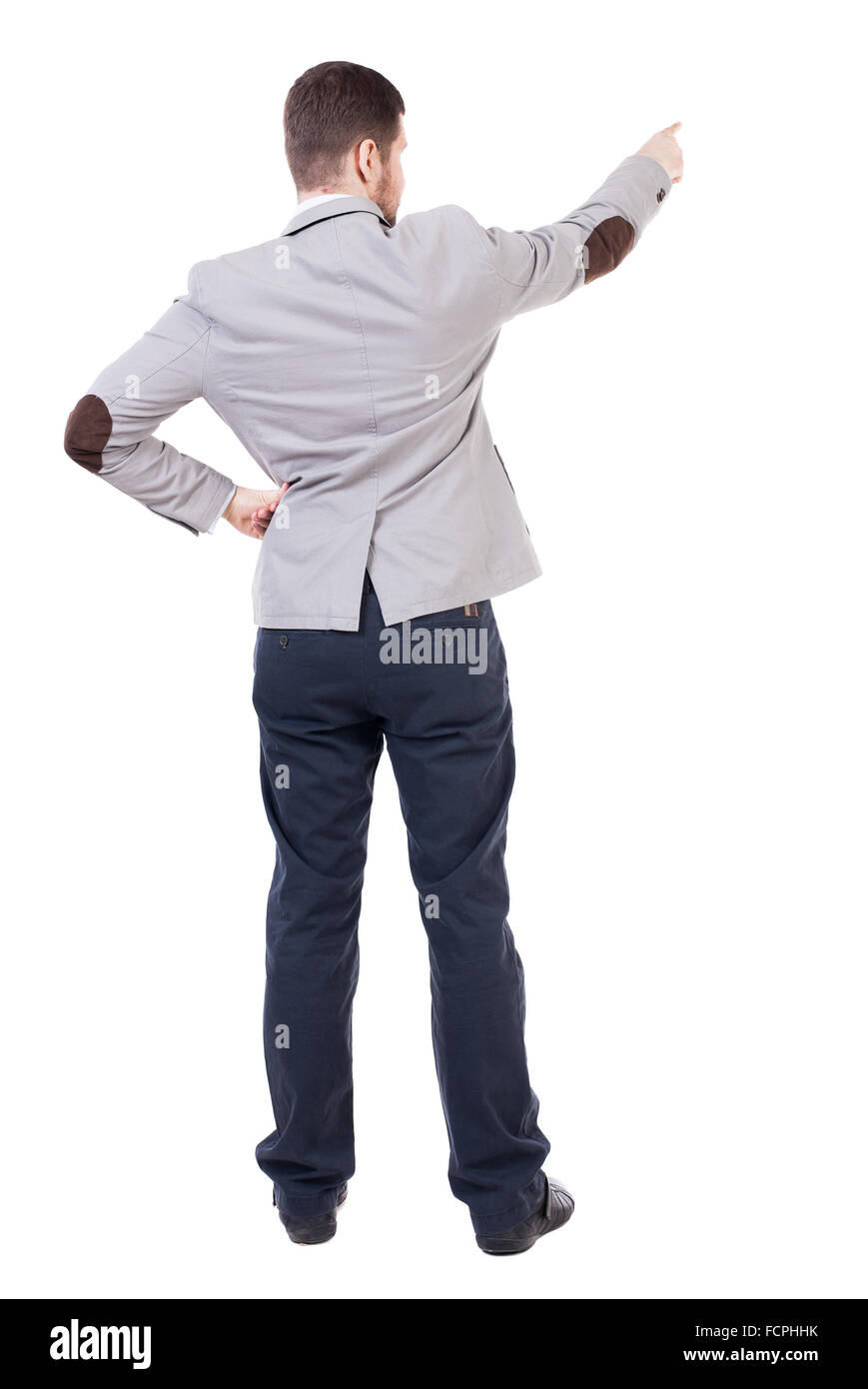 Back view of pointing business man. gesticulating young guy in black ...