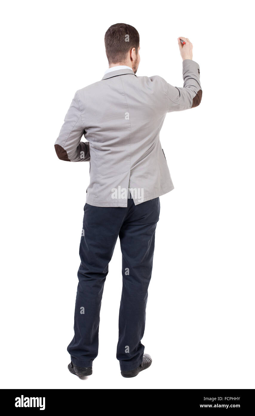 back view of writing business man in suit. Young in draws. Rear view ...