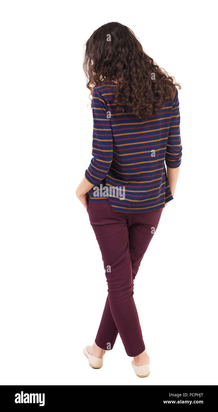 back view of standing young beautiful woman. girl watching. Rear view ...