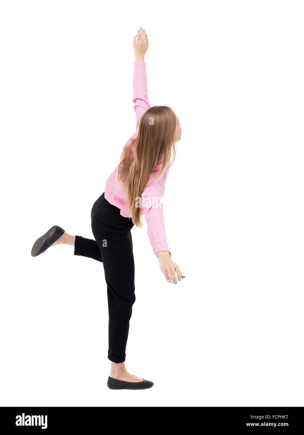 Balancing young business woman. or dodge falling woman. Rear view ...