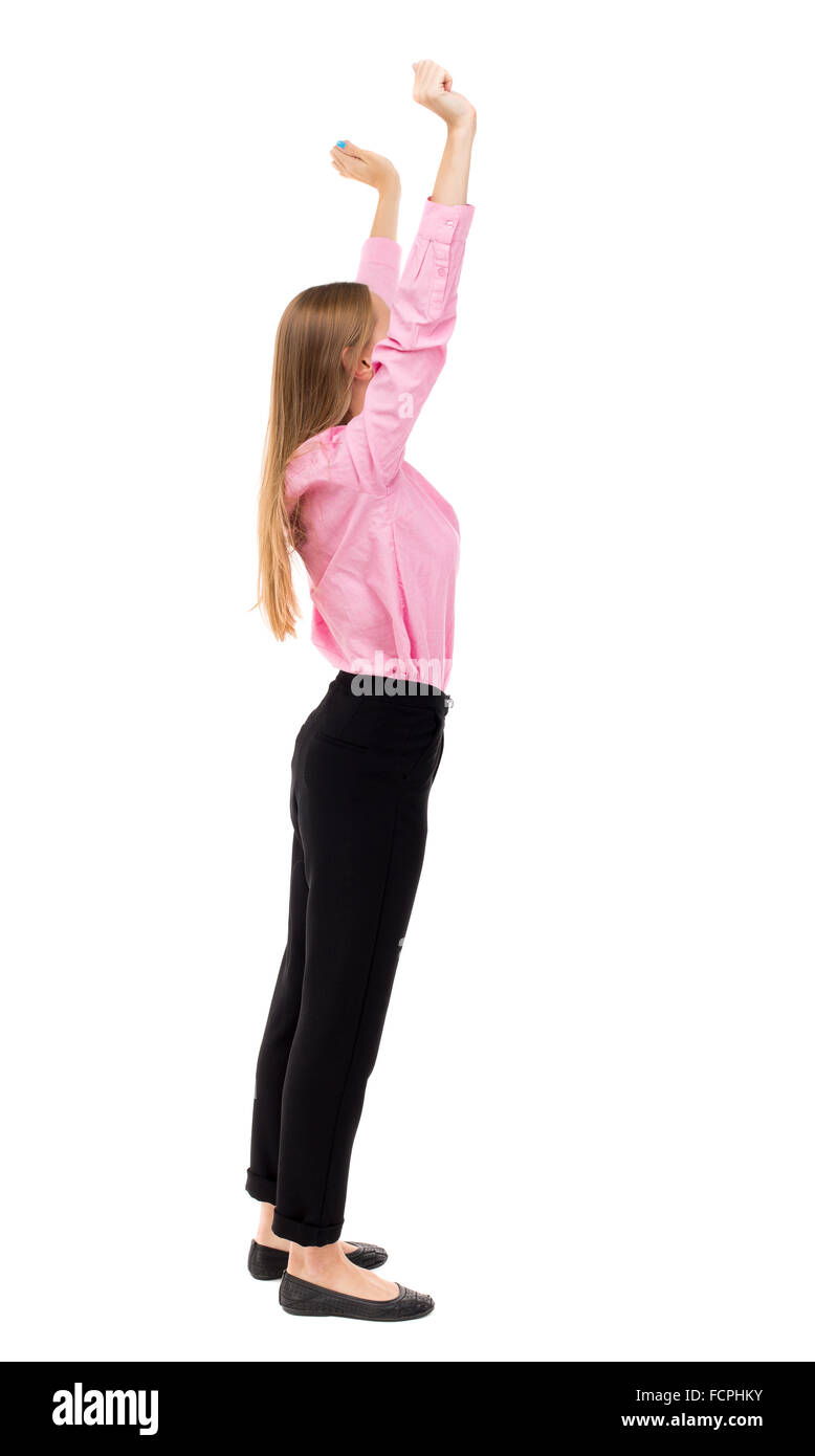 Back view of joyful woman celebrating victory hands up. Rear view ...