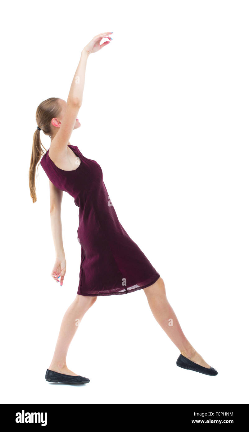 Balancing young woman. or dodge falling woman. Rear view people ...