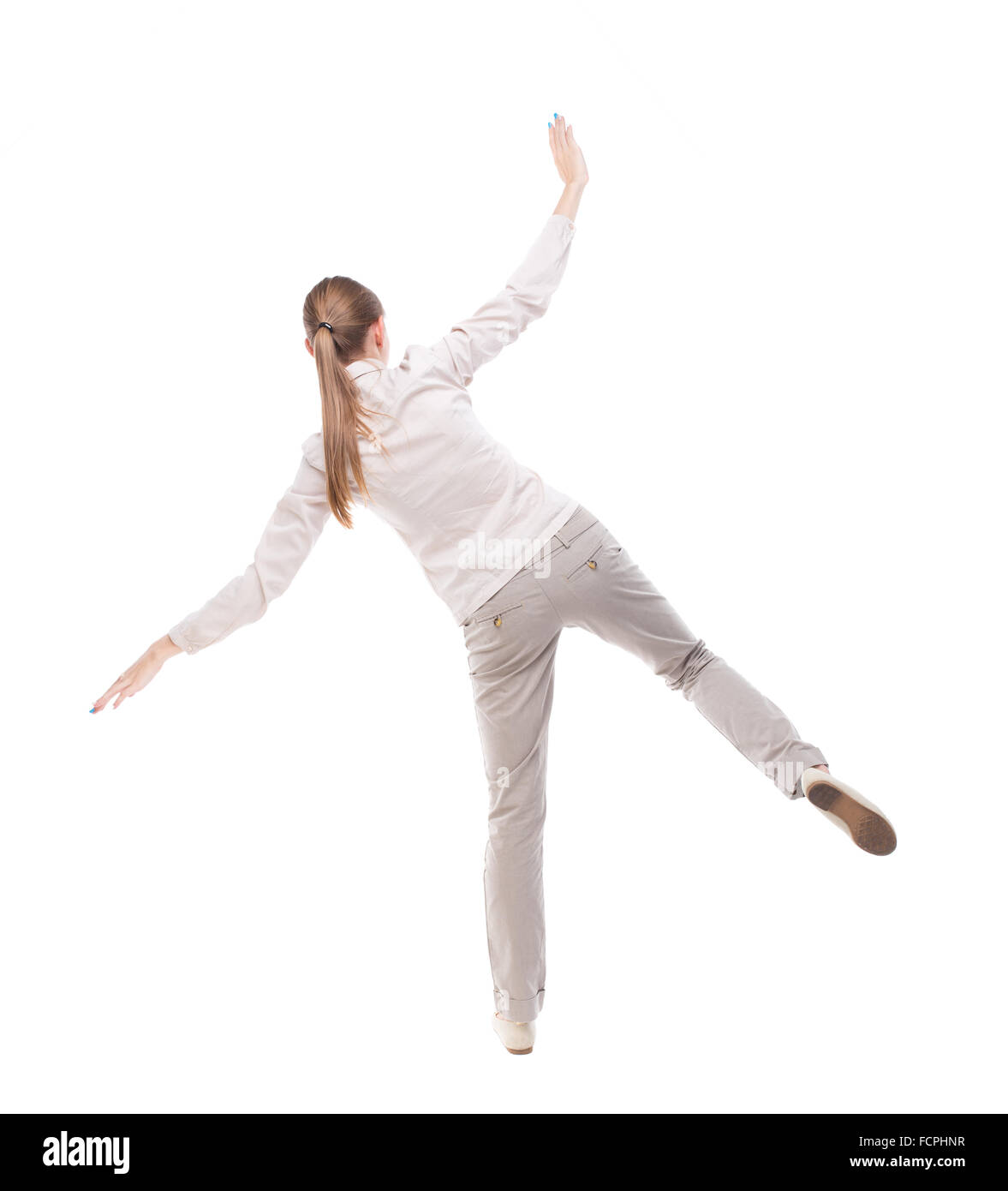 Balancing young woman. or dodge falling woman. Rear view people ...