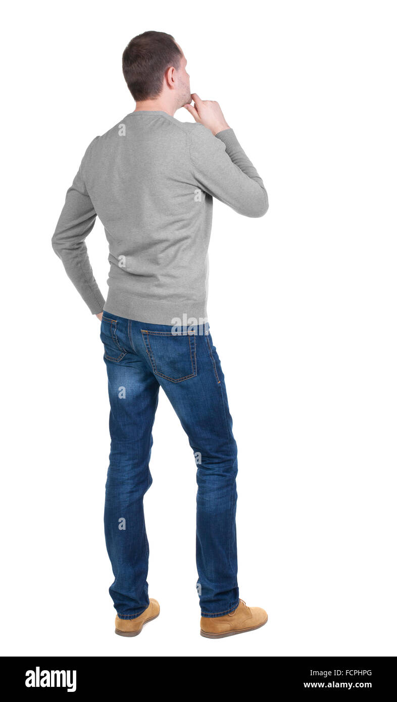 Back view of handsome man in blue pullover. Standing young guy in ...