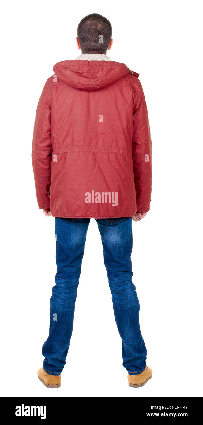 Back view of handsome man in winter jacket looking up. Standing young ...