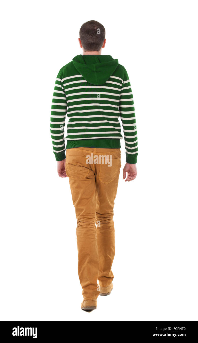 Back view of going handsome man in jeans and striped sweater. walking ...