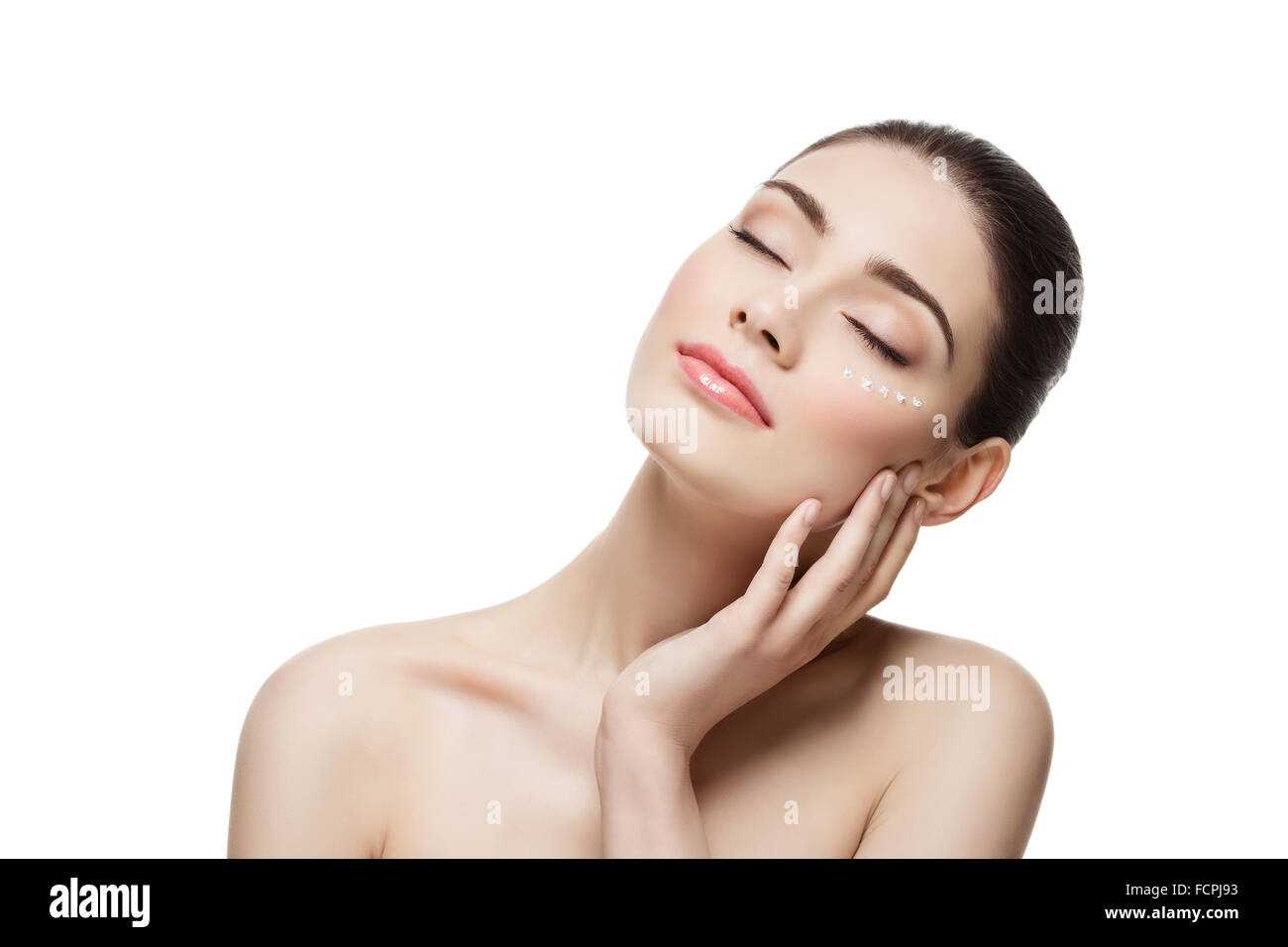 Girl with cream dots on face Stock Photo - Alamy