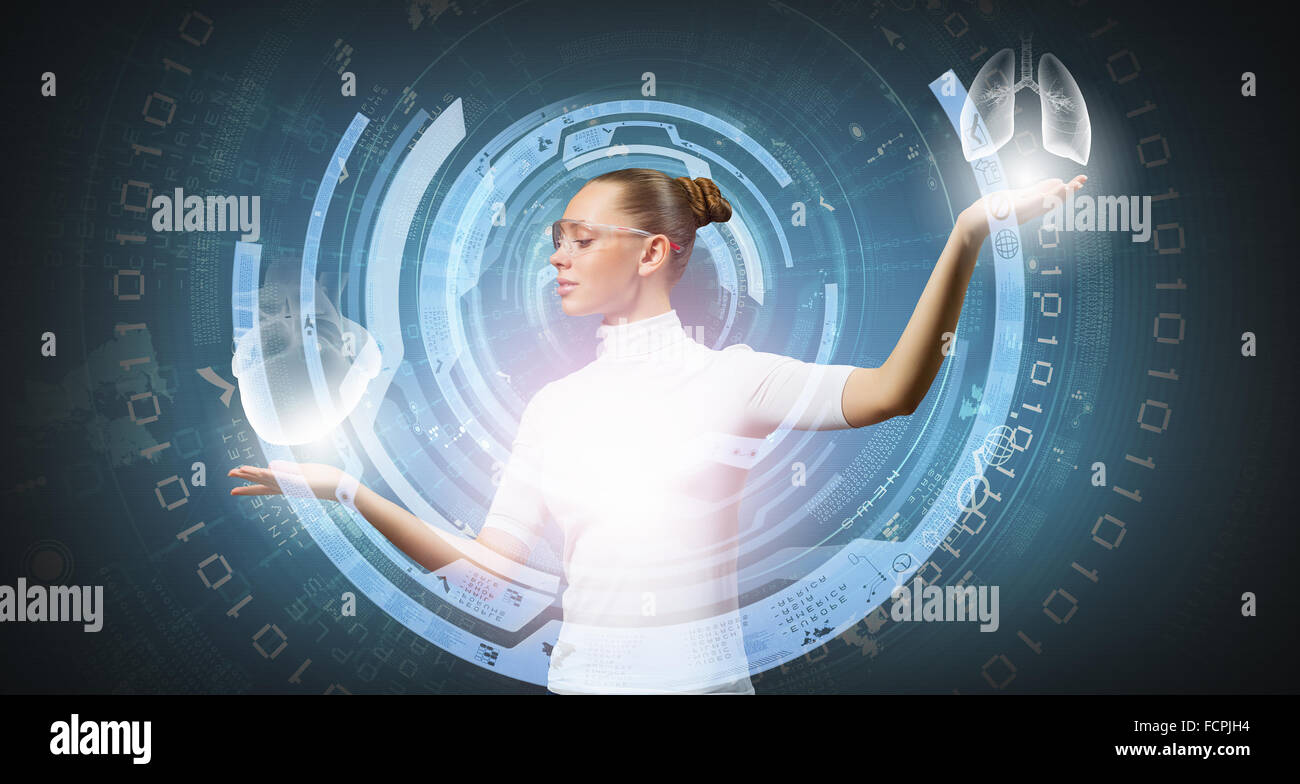 Picture of futuristic woman working with virtual technology Stock Photo ...