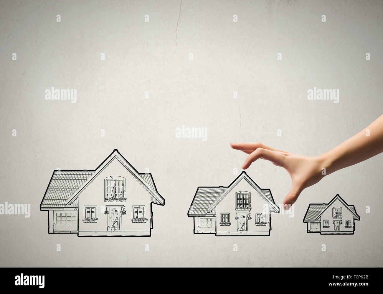 Human hand grabs drawn on paper house Stock Photo - Alamy