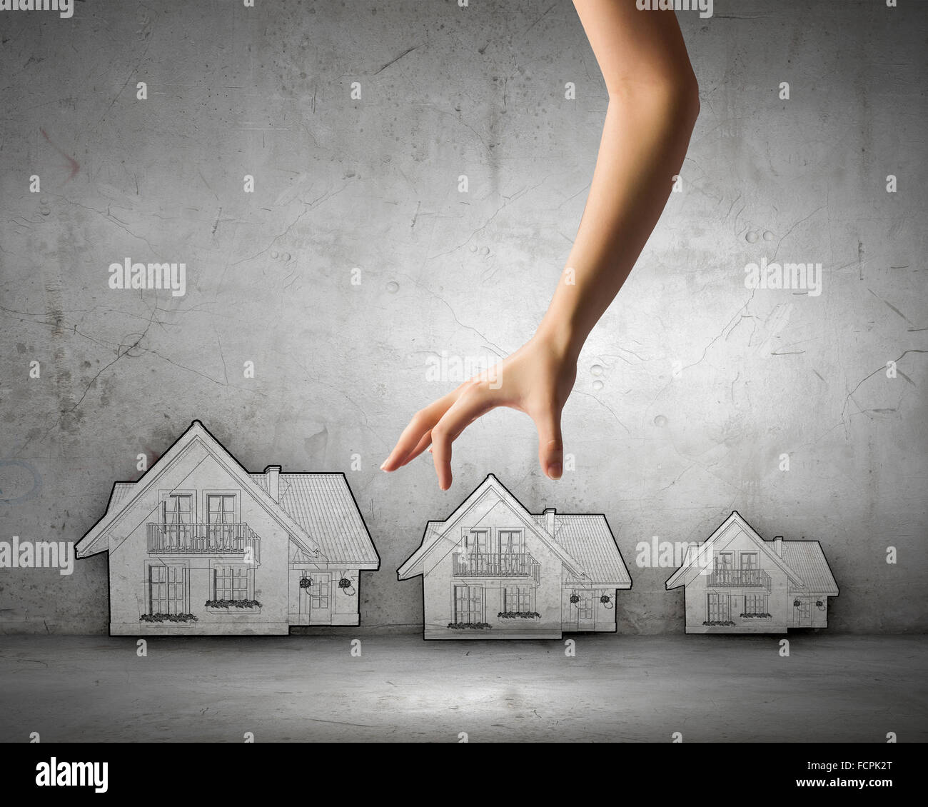 Human hand grabs drawn on paper house Stock Photo - Alamy