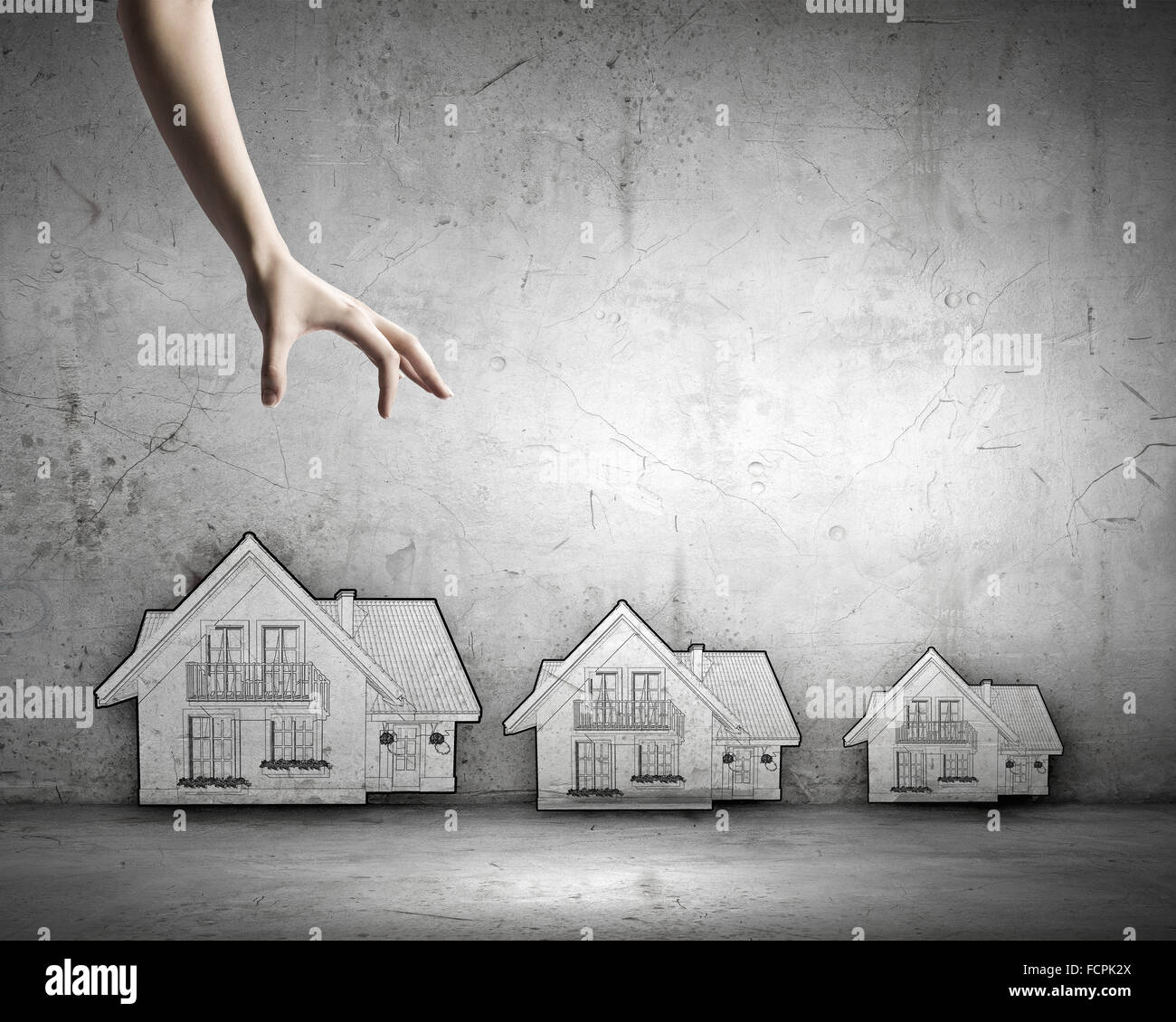 Human hand grabs drawn on paper house Stock Photo - Alamy