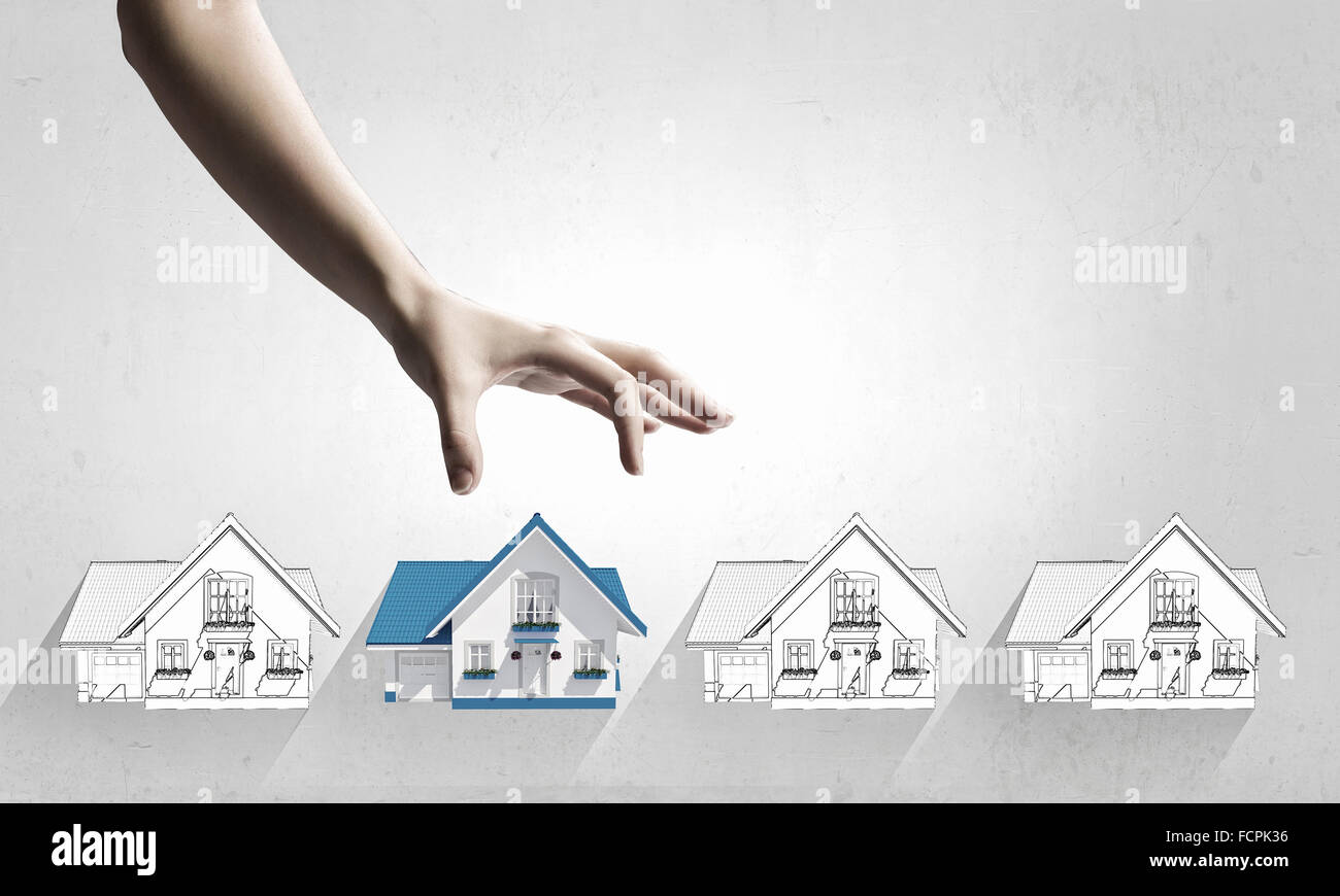 Human hand grabs drawn on paper house Stock Photo - Alamy